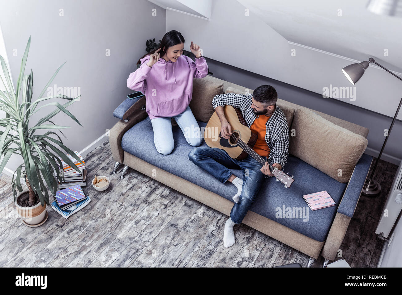Delighted nice happy woman dancing to music Stock Photo - Alamy