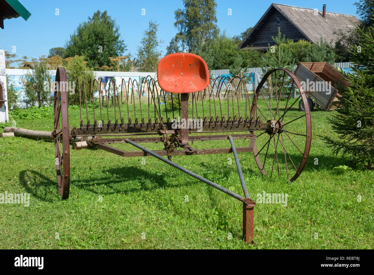 Old farm equipment on the farm. Trailer rake Stock Photo - Alamy