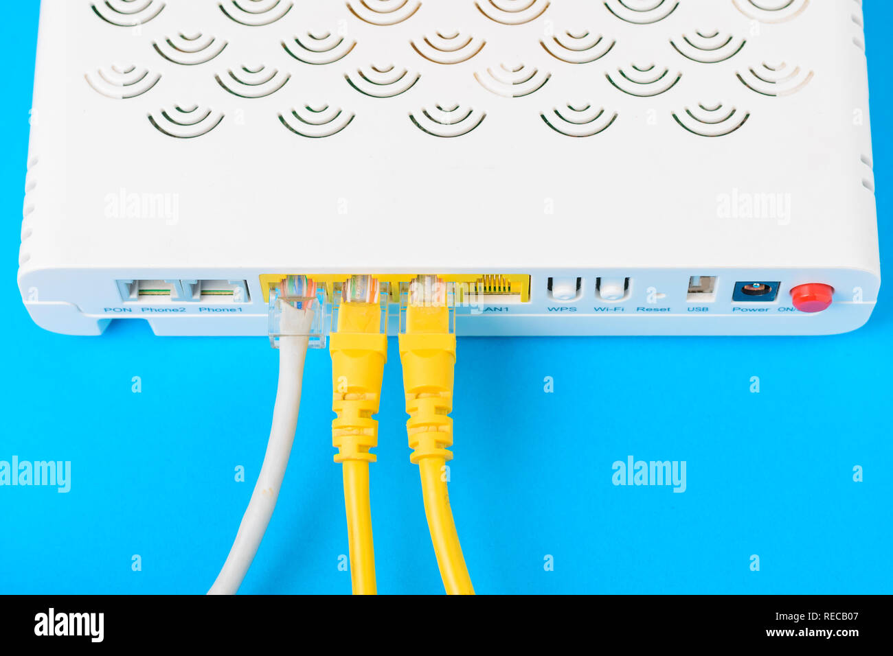 internet modem router hub with cable connecting on blue background ...