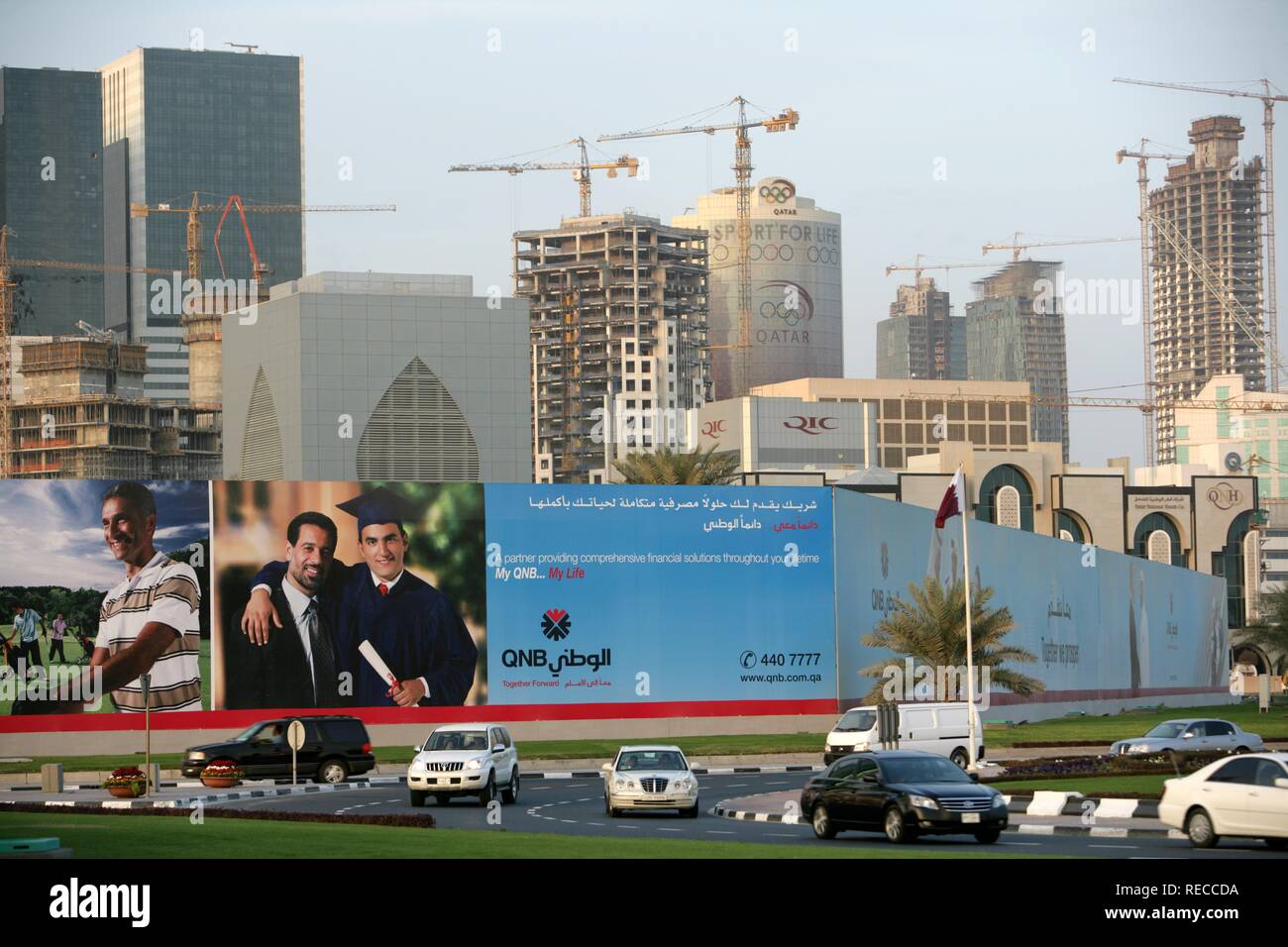 Advertising billboard for the University of Doha, high-rise building ...