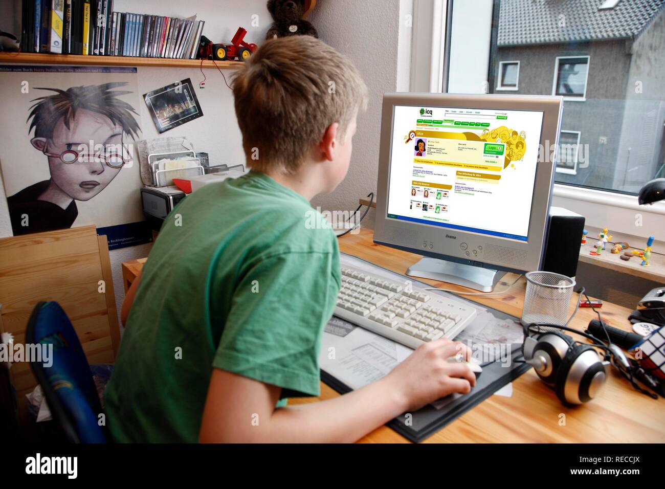 Boy, 13, surfing with his computer at home in the Internet on a chat ...