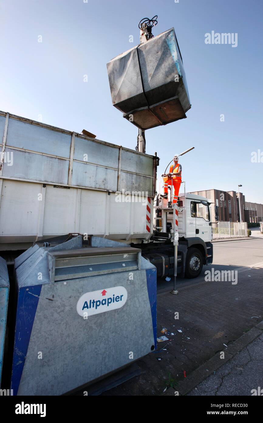Refuse collection, waste paper containers being emptied, at an external ...