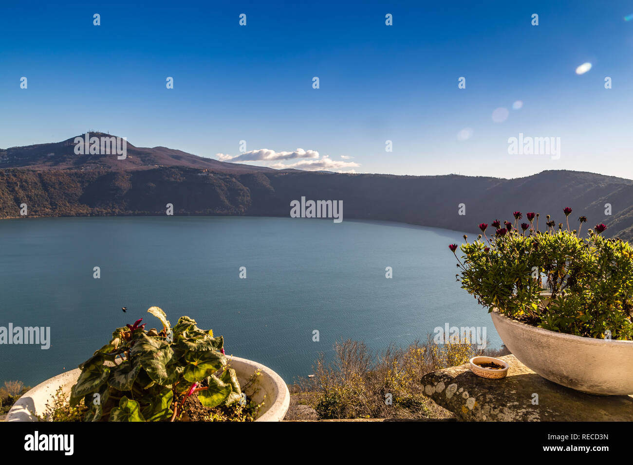 pot of flowers on view of blue waters of Italian lake Stock Photo - Alamy