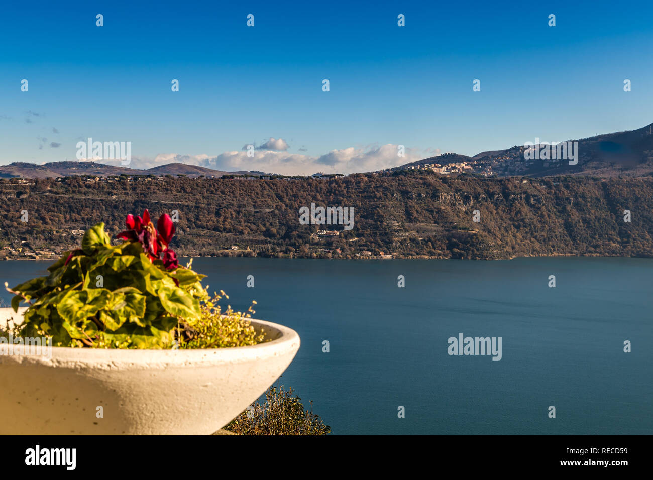 pot of flowers on view of blue waters of Italian lake Stock Photo - Alamy