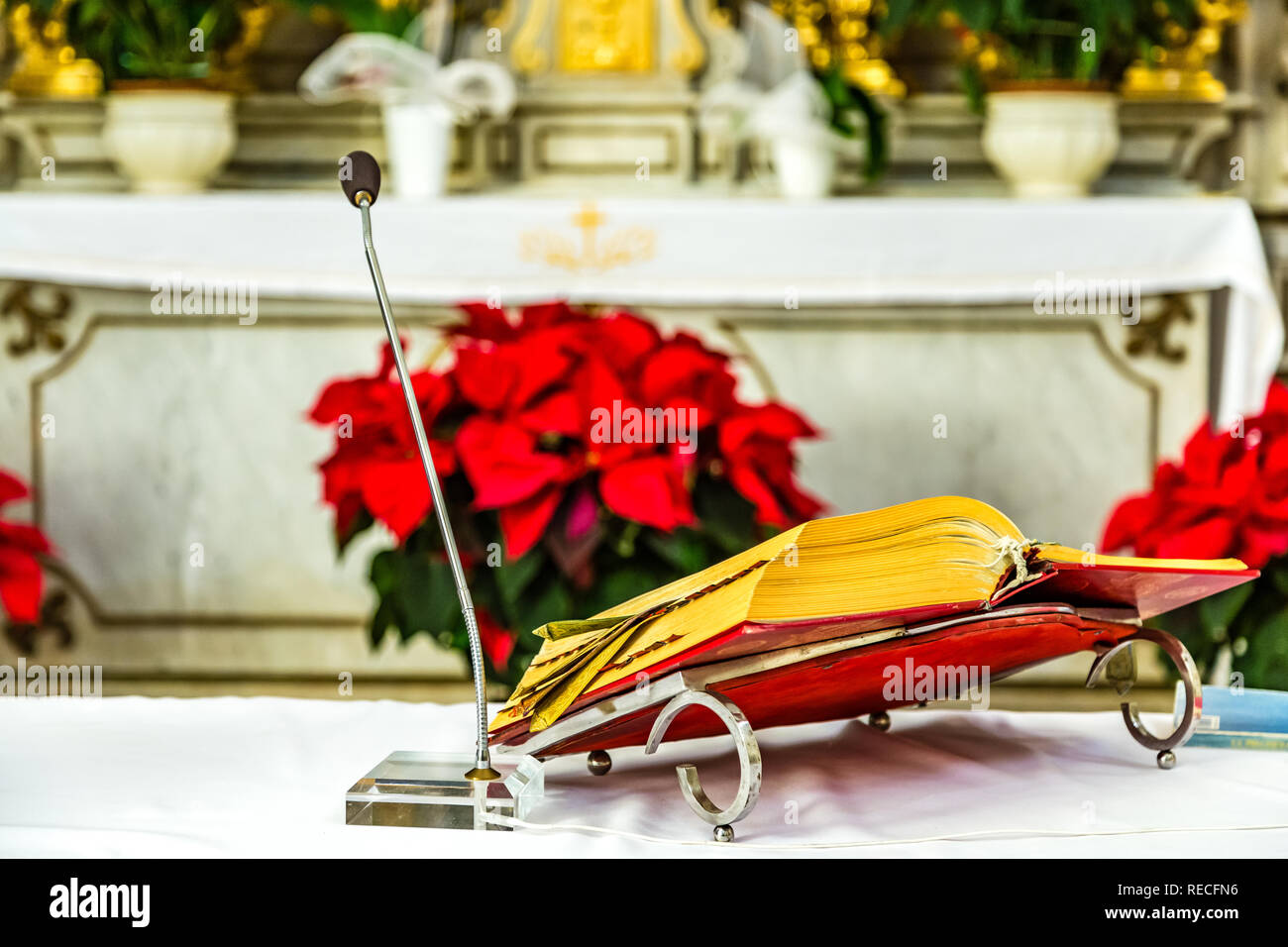 Holy Bible on altar in Catholic church Stock Photo - Alamy