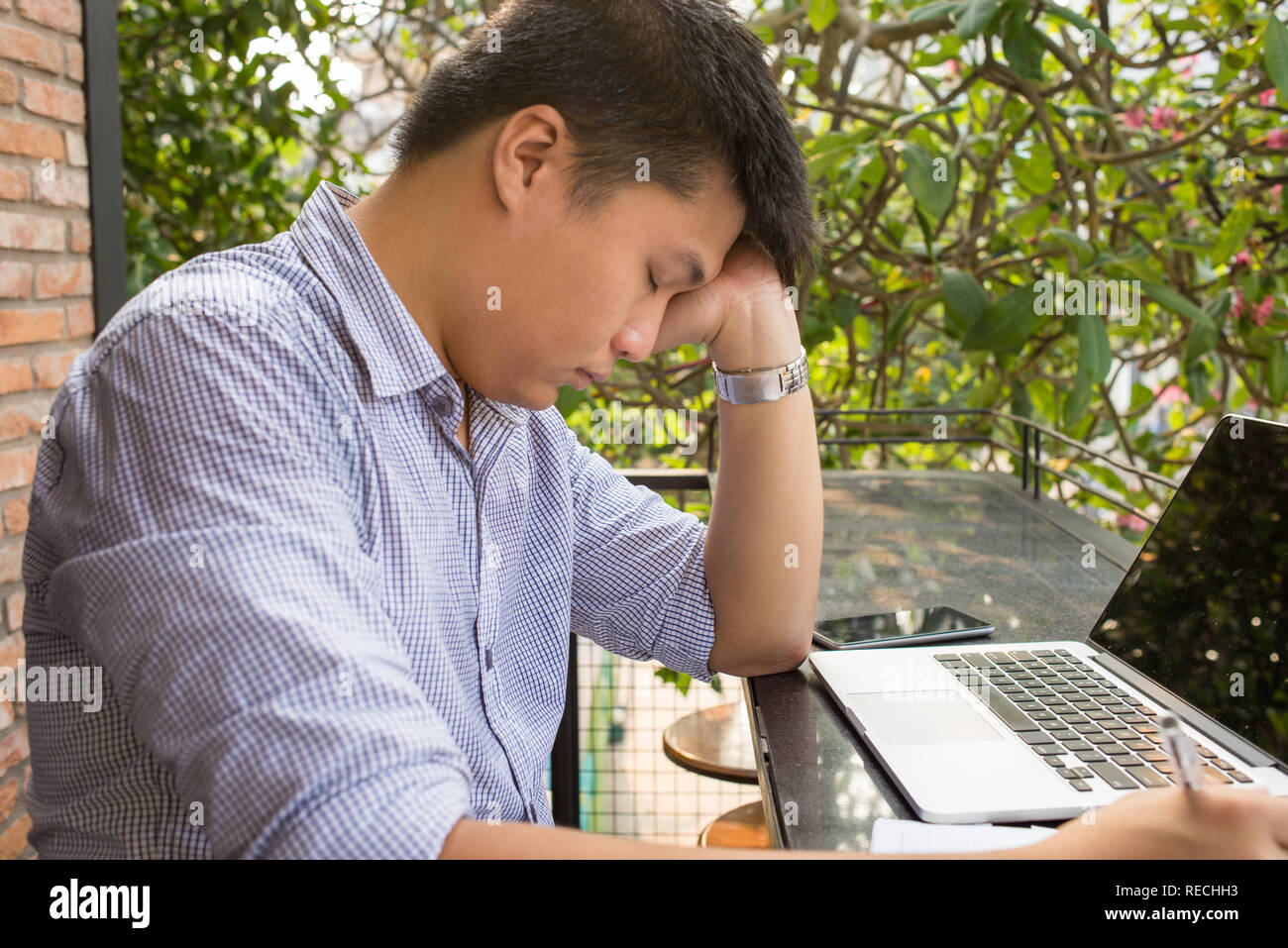 Tired businessman closing eyes and take a break Stock Photo - Alamy