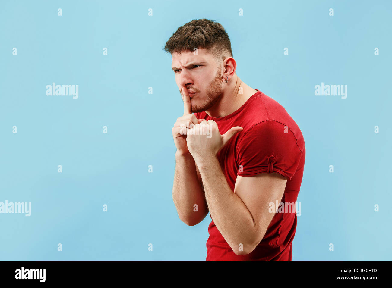 Secret, gossip concept. Young man whispering a secret behind his hand ...