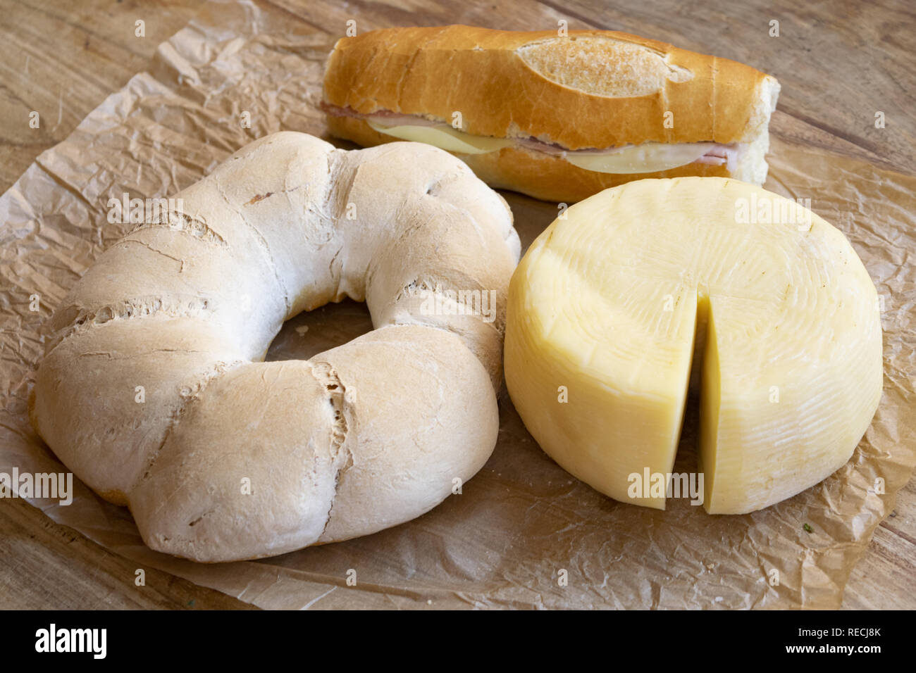 homemade loaf of bread with a whole pecorino cheese of the Monte Poro ...