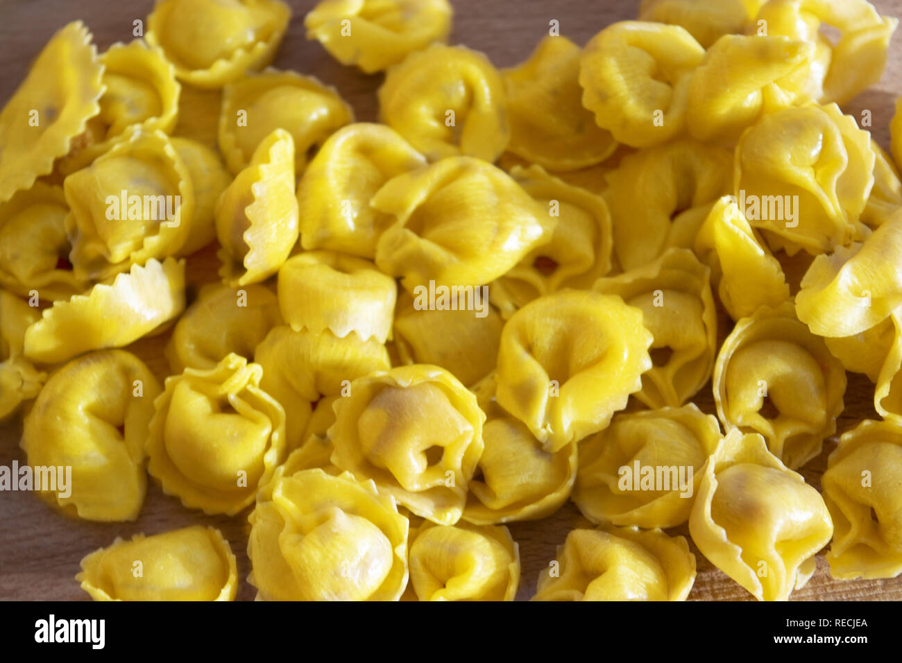 dried raw tortellini stuffed with cured ham Stock Photo - Alamy