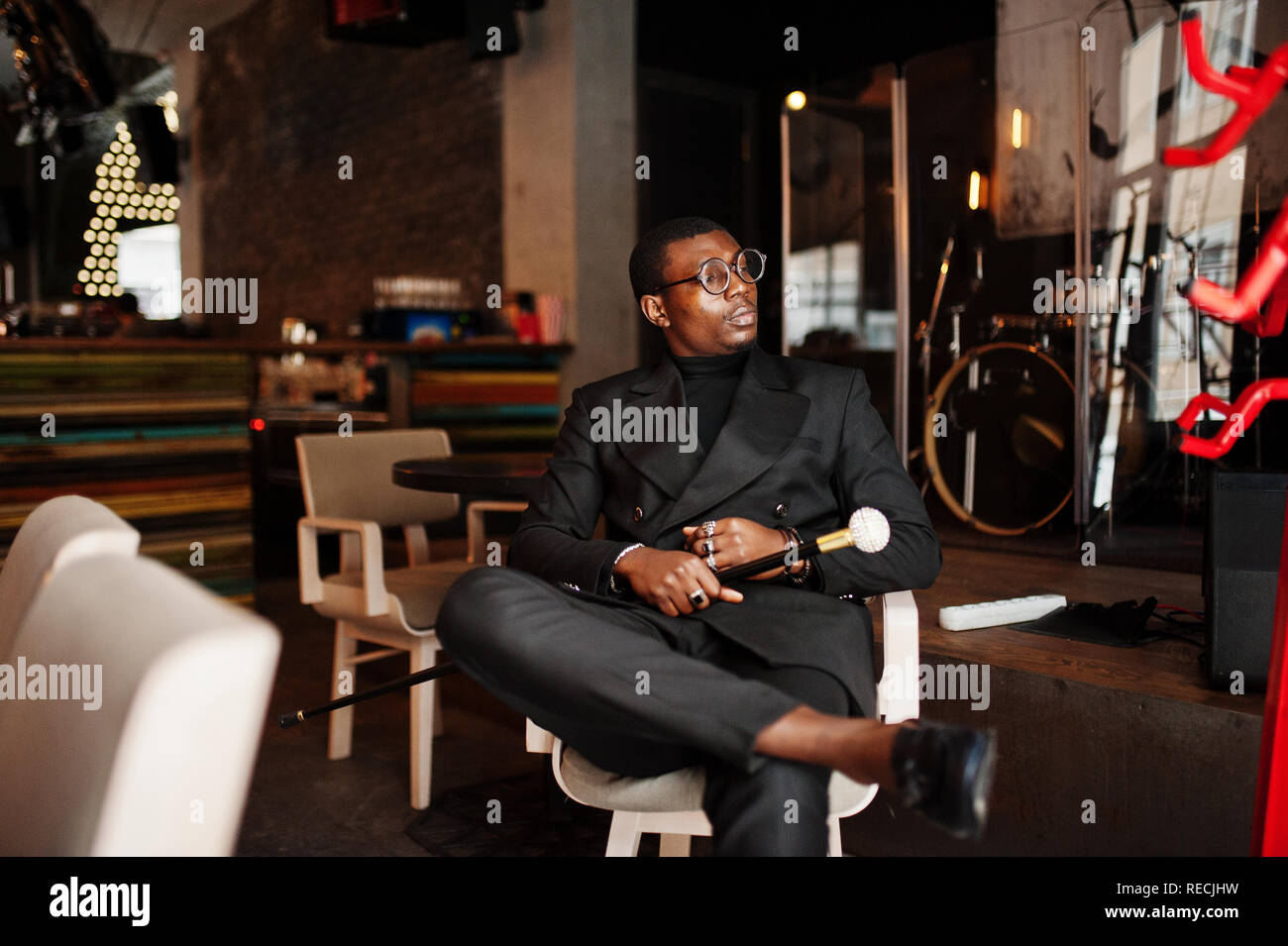 Stylish african american gentleman in elegant black jacket and glasses ...