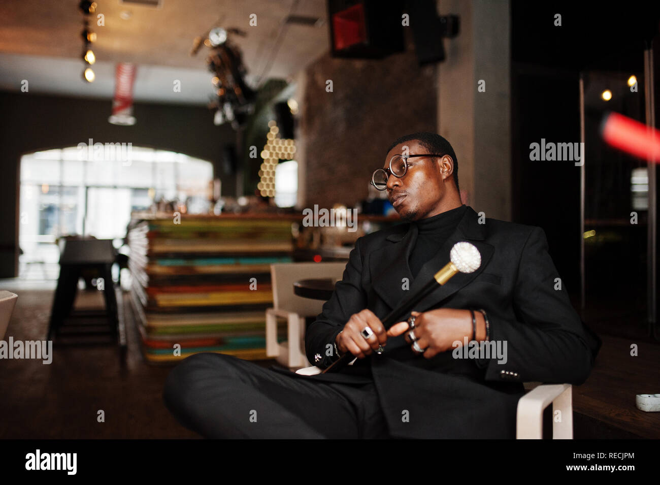 Stylish african american gentleman in elegant black jacket and glasses ...
