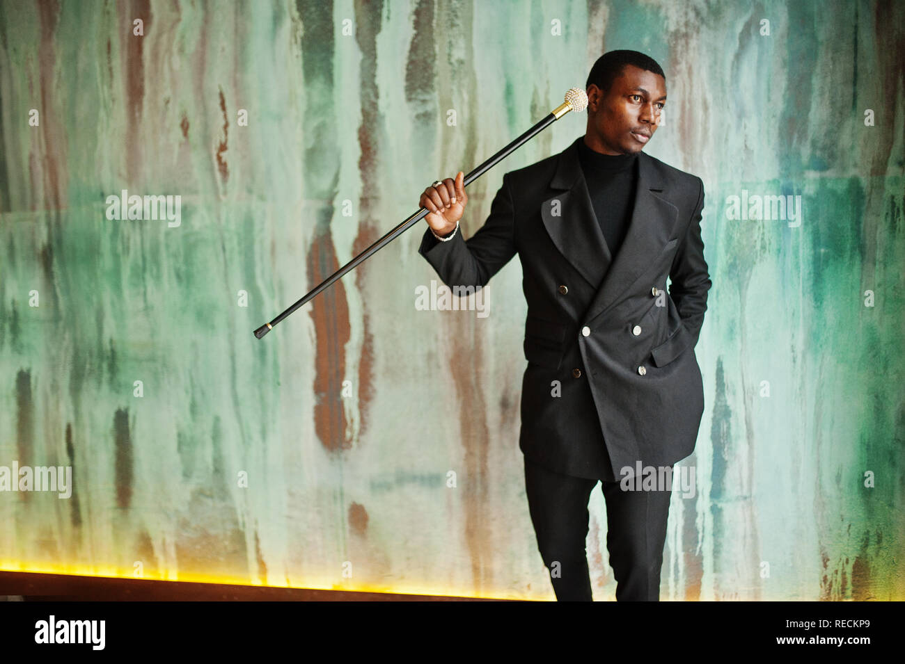 Stylish african american gentleman in elegant black jacket, holding ...