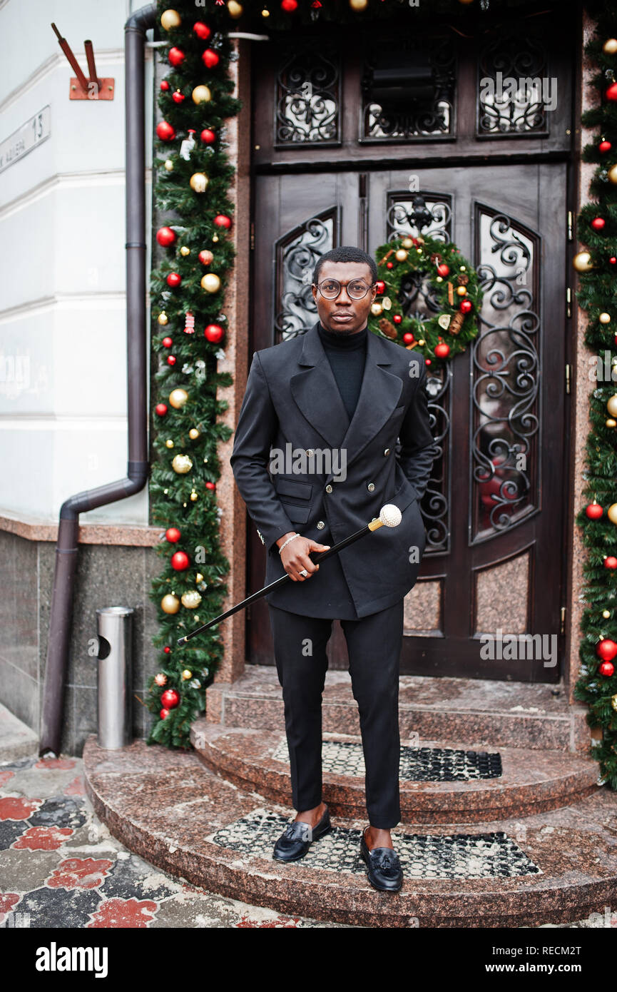 Stylish african american gentleman in elegant black jacket, holding ...