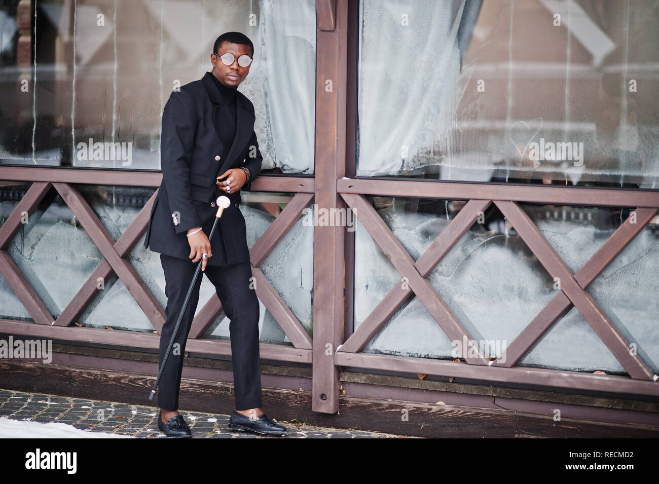 Stylish african american gentleman in elegant black jacket, holding ...