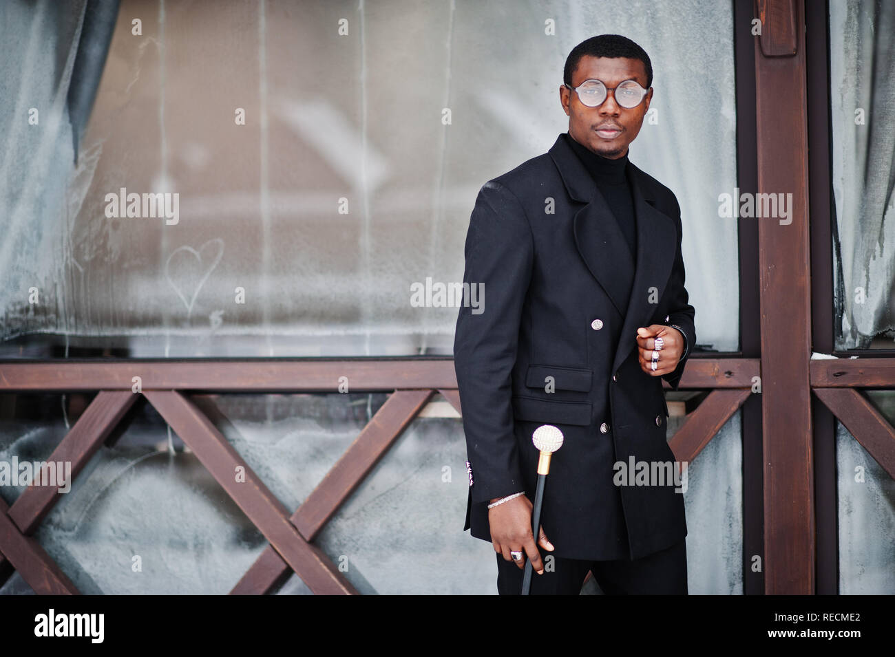 Stylish african american gentleman in elegant black jacket, holding ...