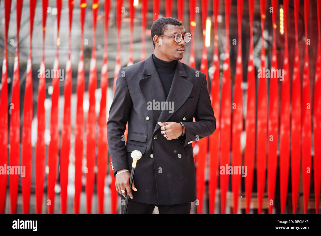 Stylish african american gentleman in elegant black jacket, holding ...