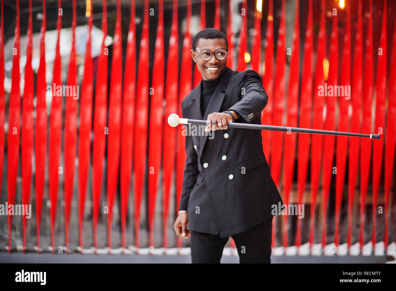 Stylish african american gentleman in elegant black jacket, holding ...