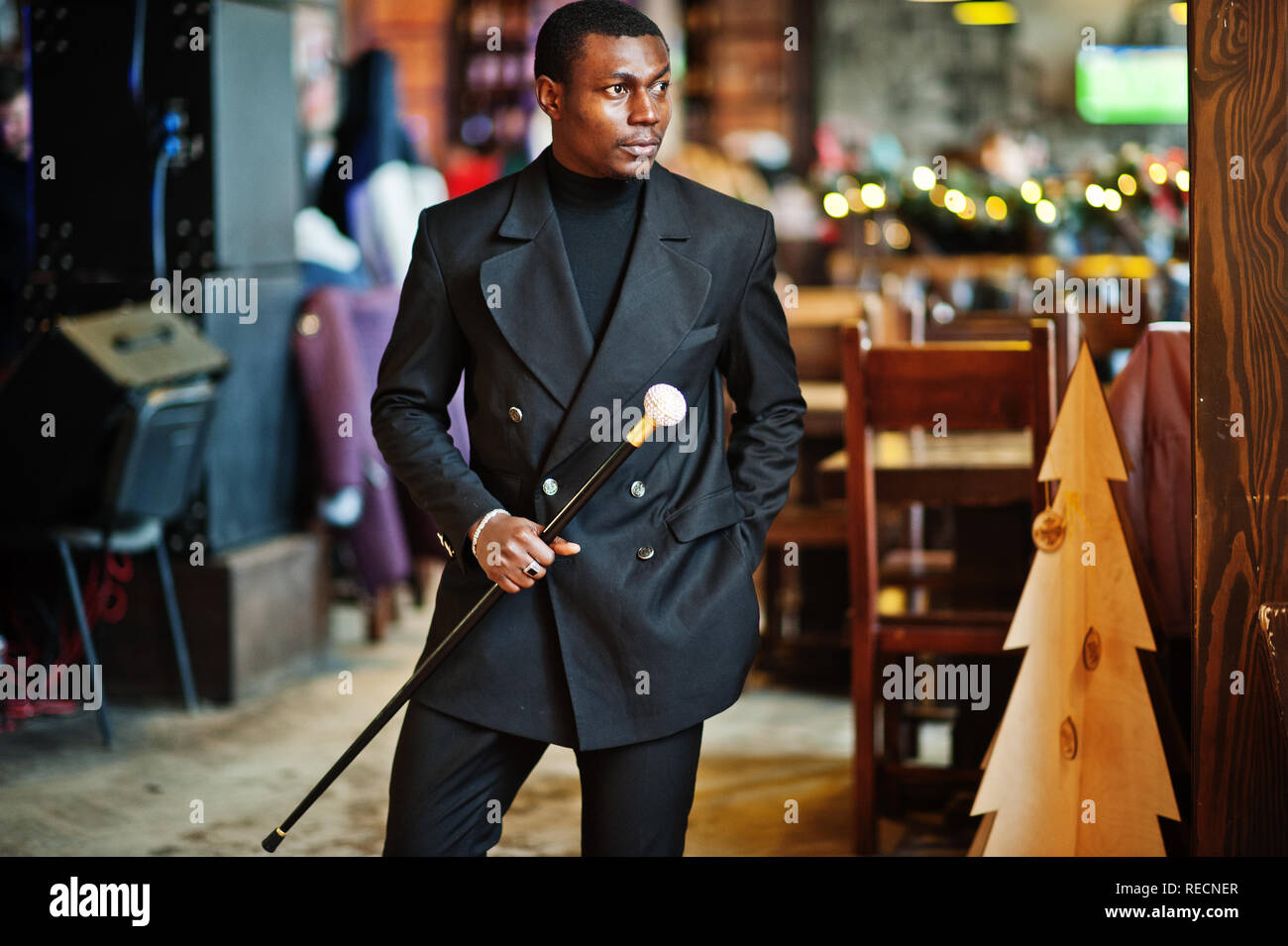 Stylish african american gentleman in elegant black jacket, holding ...