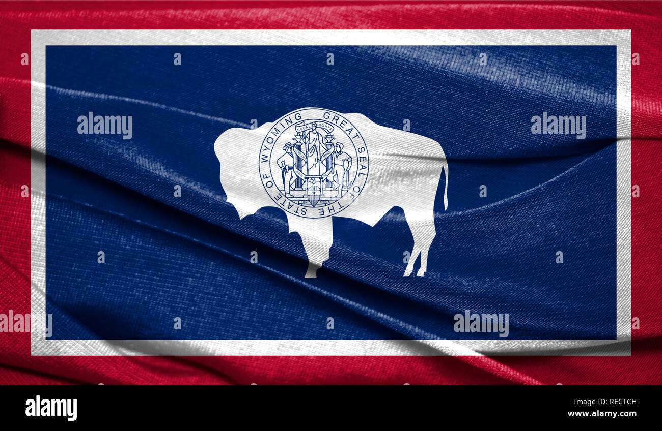 Realistic flag of State of Wyoming on the wavy surface of fabric ...