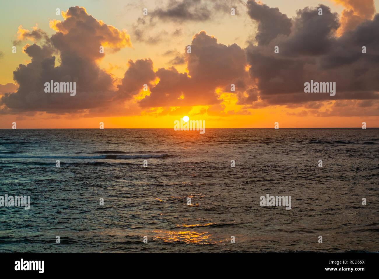 Golden sunrise with reflection of the sun in the water hi-res stock ...