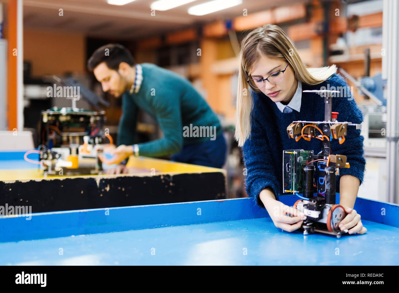 Young student of robotics working on project Stock Photo - Alamy
