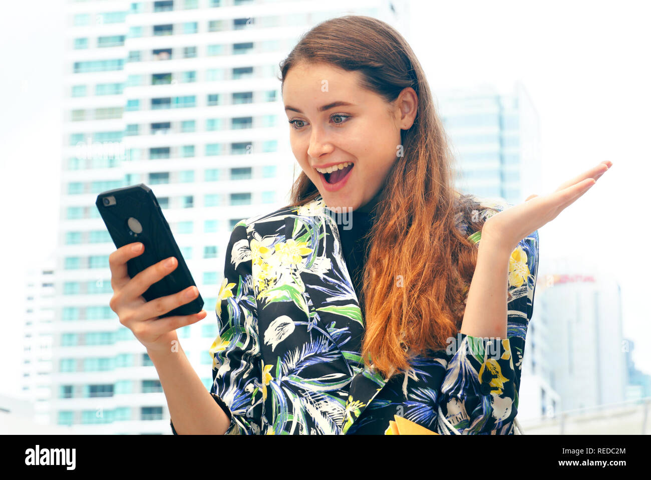 Beautiful women feel surprise when receive message from smartphone ...