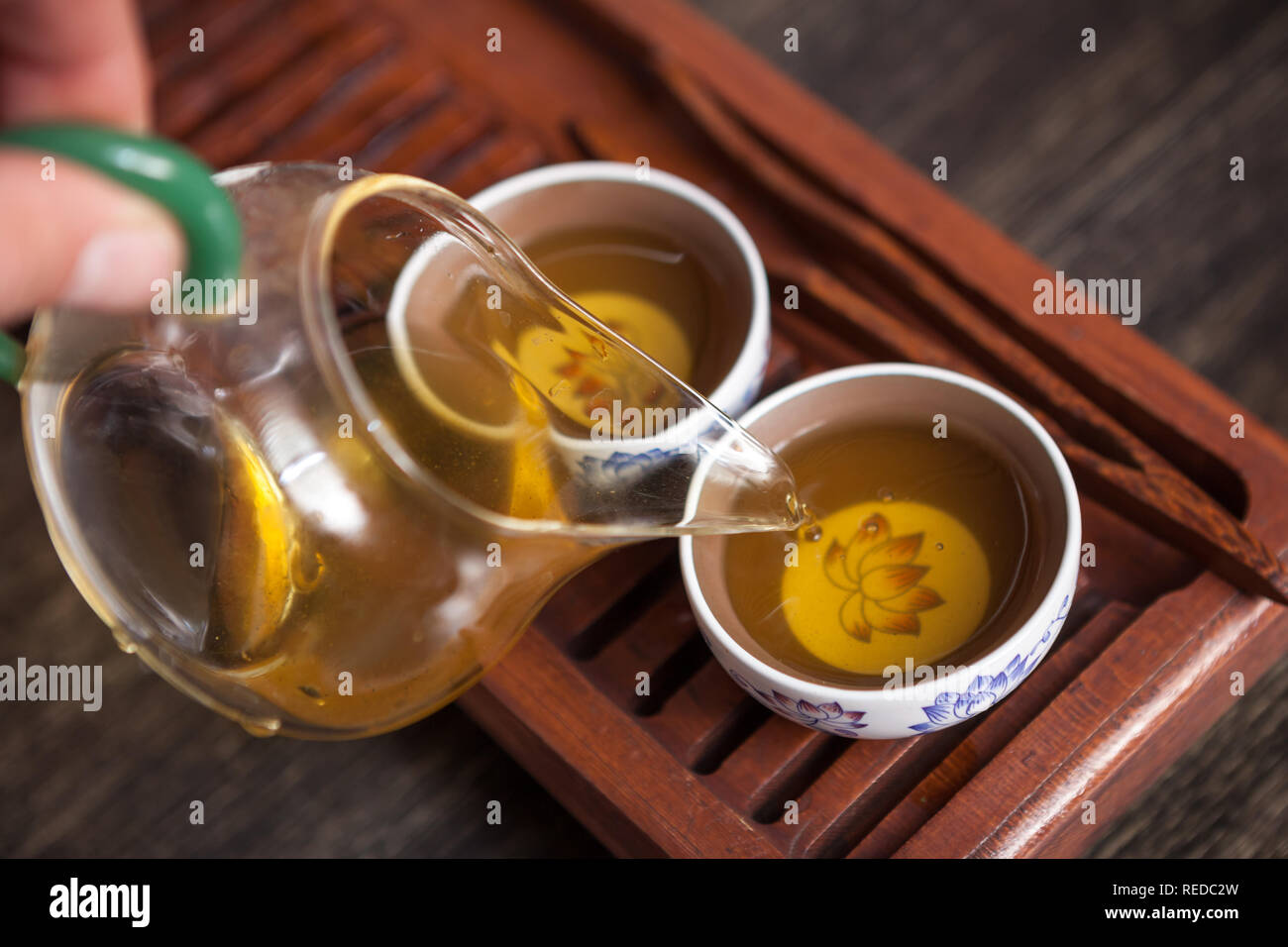 Cropped shot of pouring tea in traditional chinese teaware Stock Photo ...