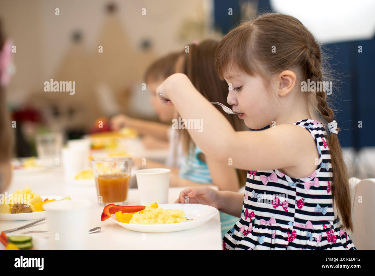 children eating healthy food in daycare centre or kindergarten Stock ...