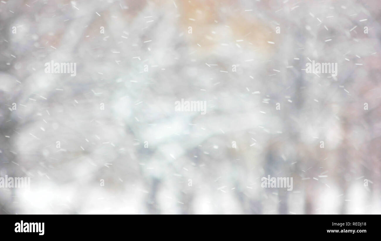 Blurred winter background with falling snow. Heavy snowfall with blurry ...