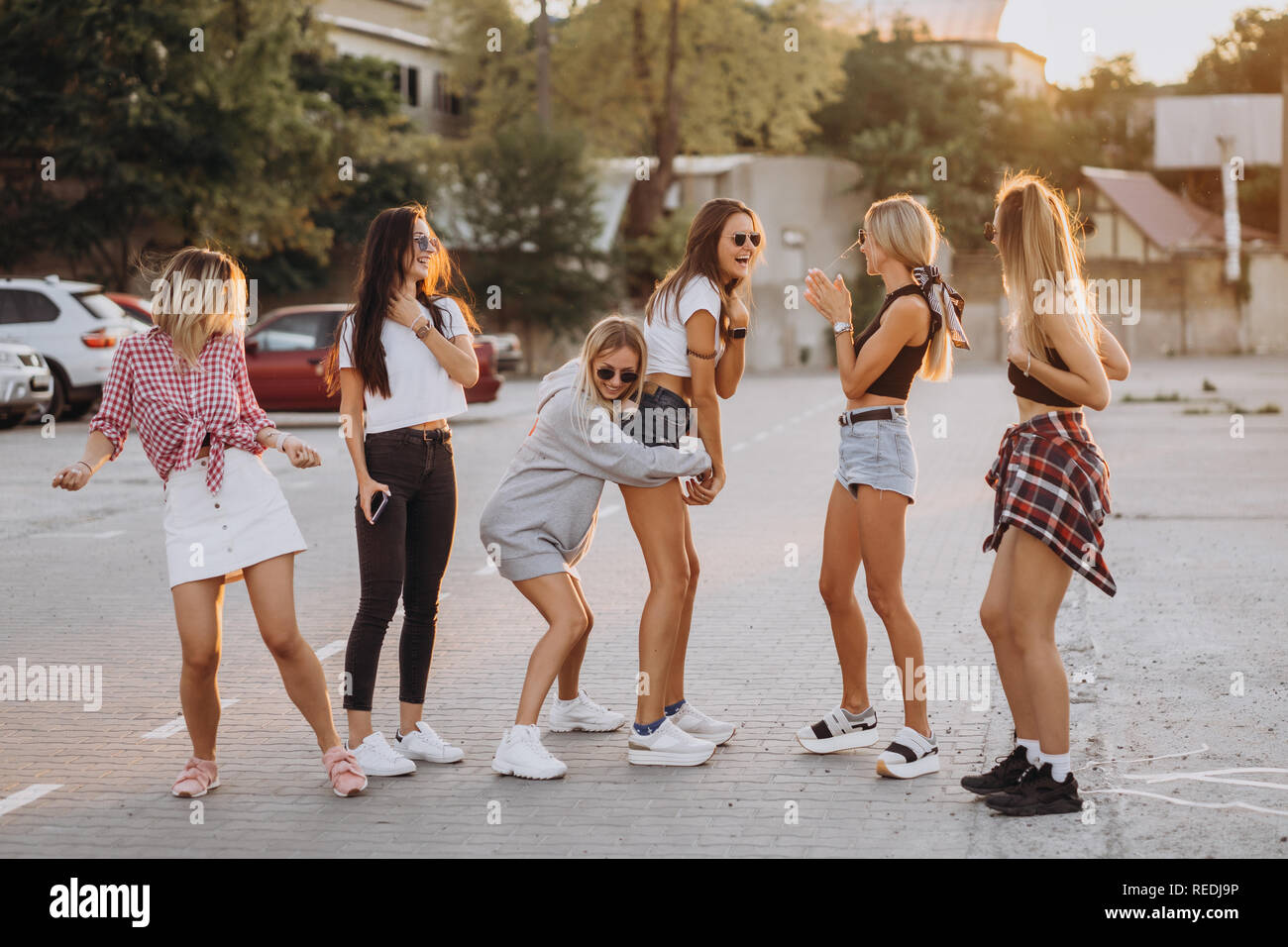 Six young women dance in a car park Stock Photo - Alamy