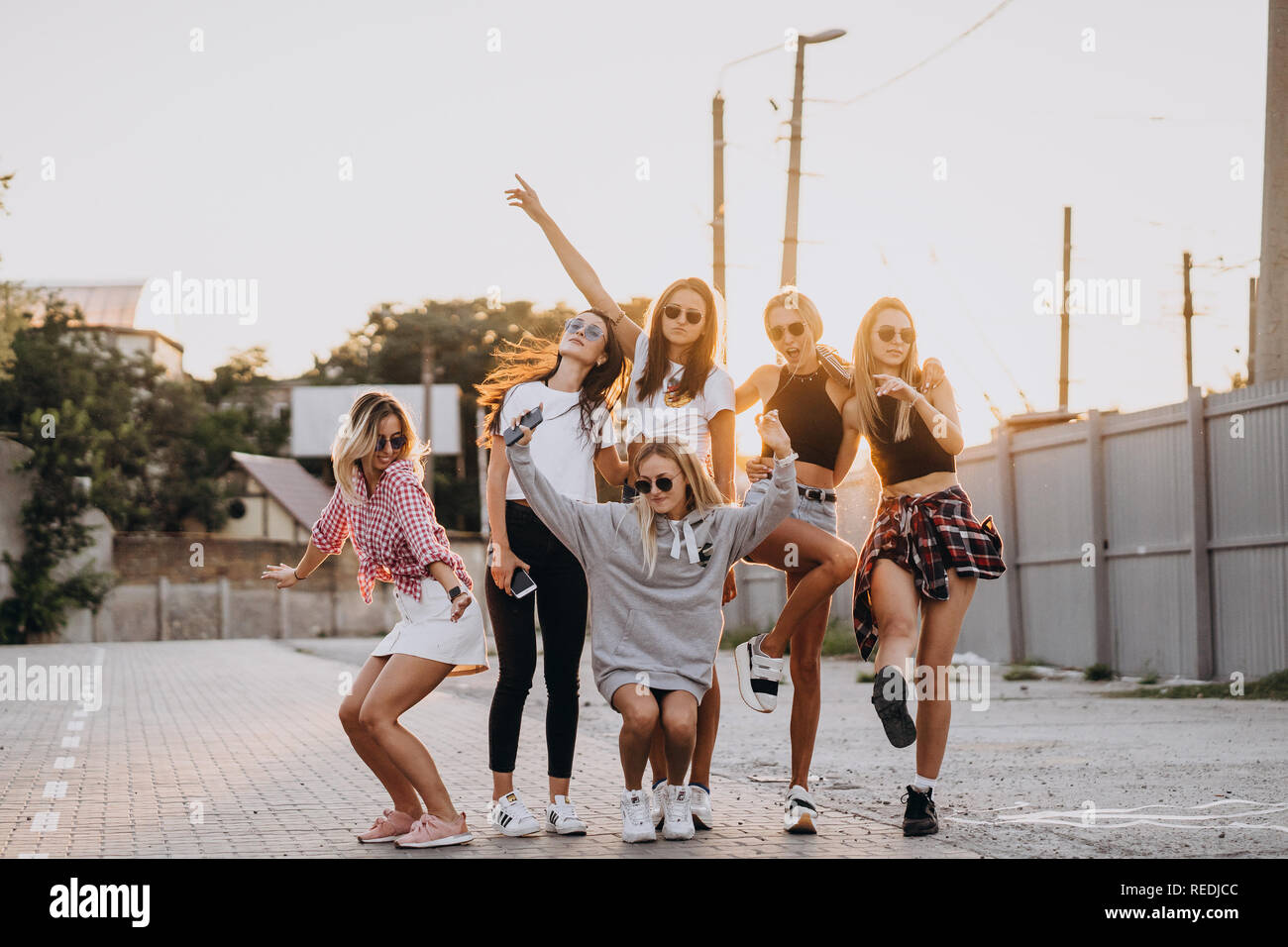 Six young women dance in a car park Stock Photo - Alamy