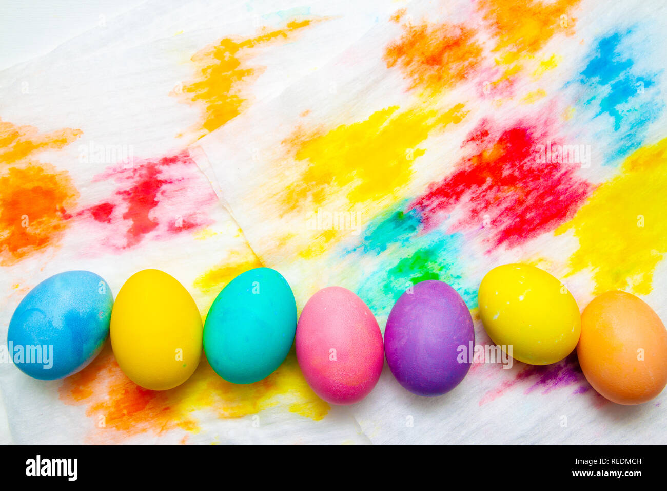 Colorful Easter eggs frame border on multicolor painted background. top ...