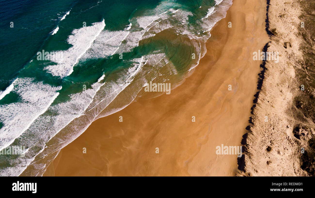 Beautiful aerial view of a beach with waves. Natural textures and ...