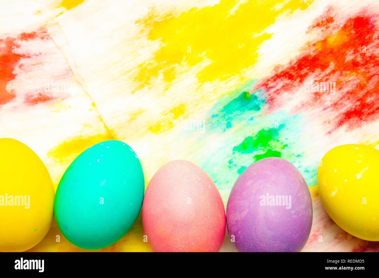 Colorful Easter eggs frame border on multicolor painted background. top ...