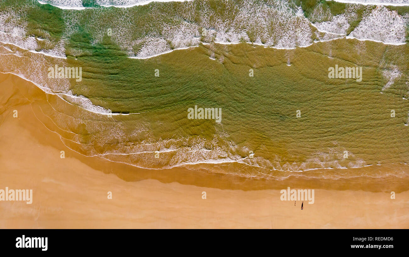 Beautiful aerial view of a beach with waves. Natural textures and ...