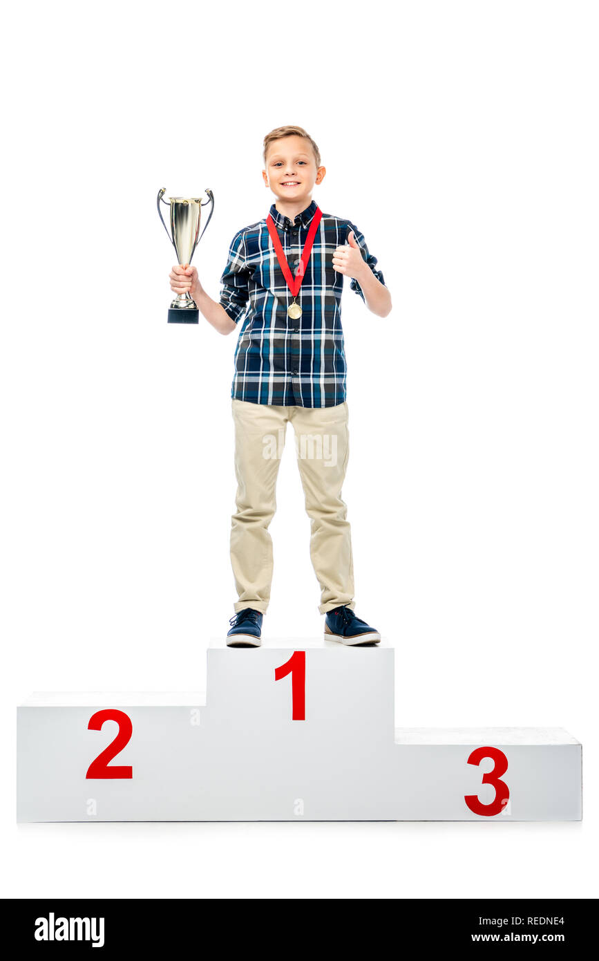 Boy holding trophy smiling hi-res stock photography and images - Alamy