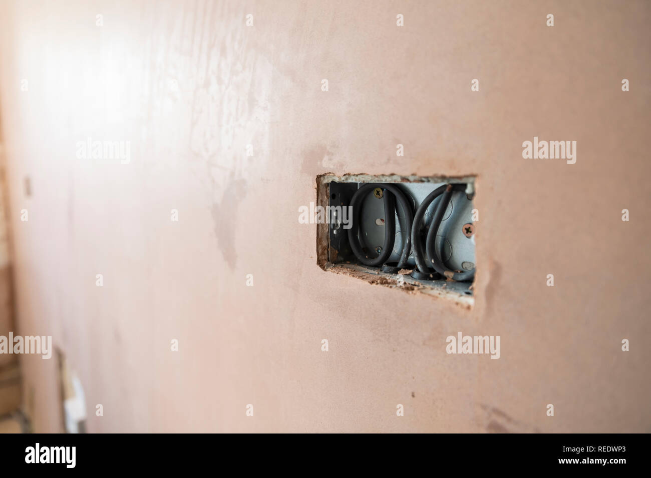 First fix domestic electrics in a freshly plastered wall Stock Photo ...
