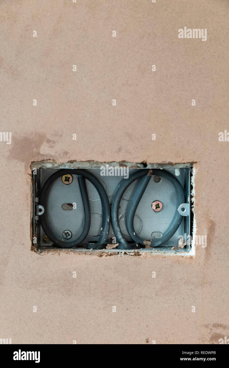First fix domestic electrics in a freshly plastered wall Stock Photo ...