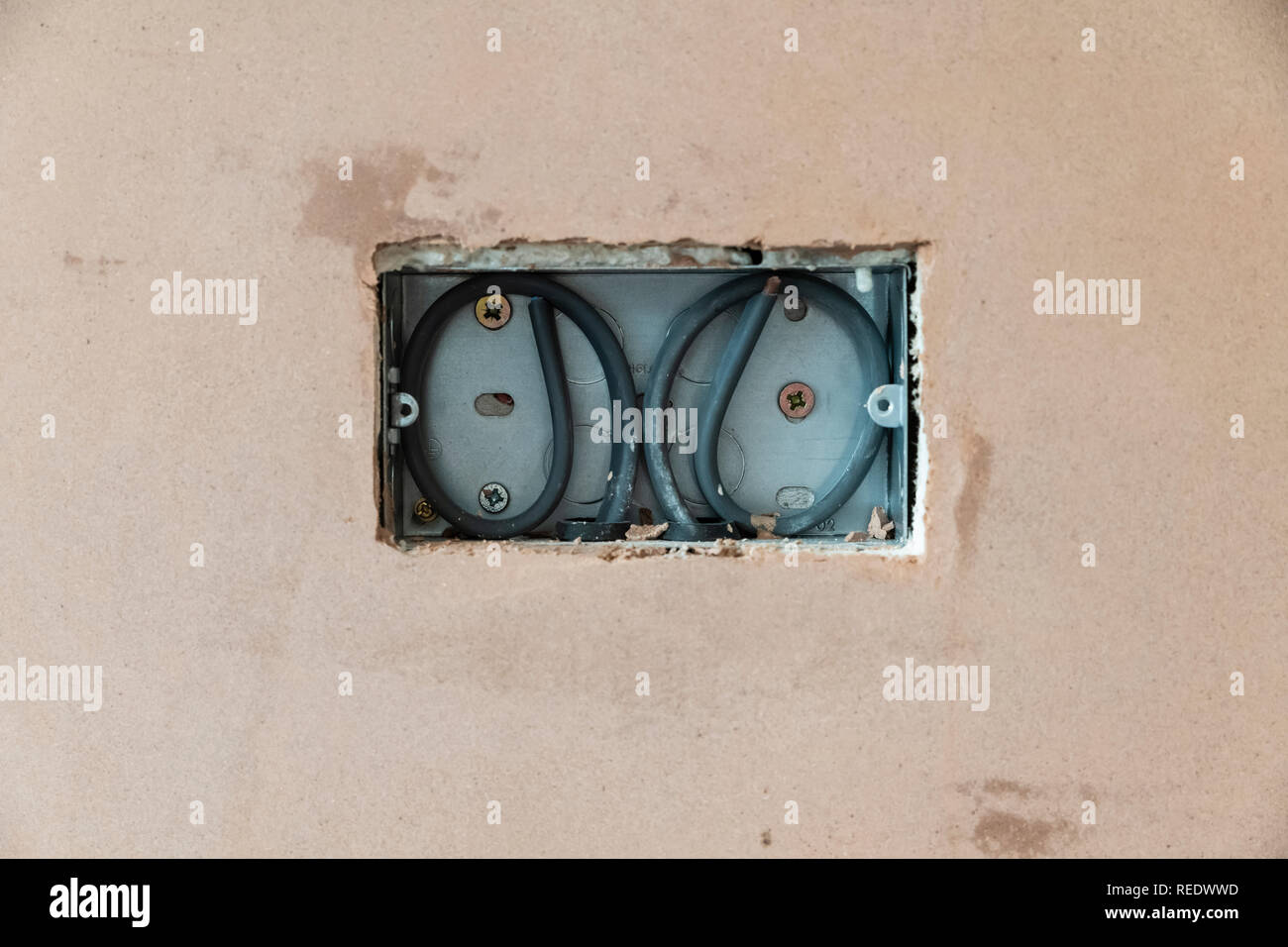 First fix domestic electrics in a freshly plastered wall Stock Photo ...