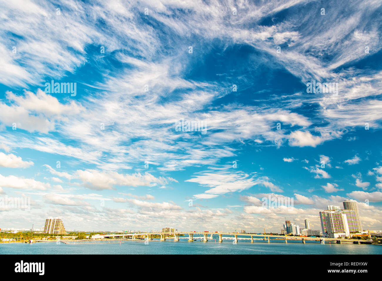 Miami landscape view on water channel, bridge with transportation on ...