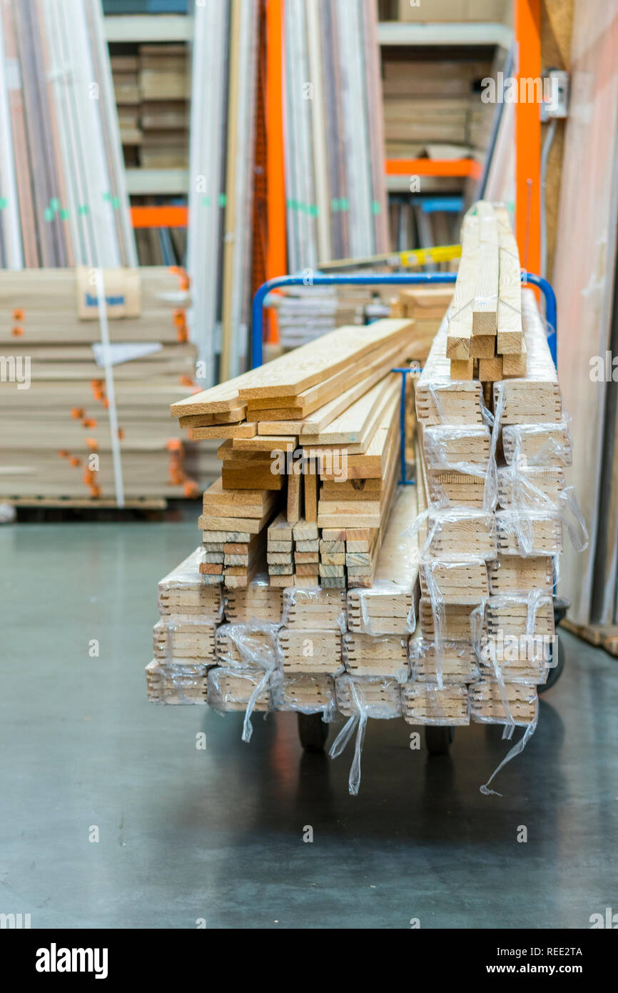 construction cart in the building store. Carts loaded with boards. shop ...
