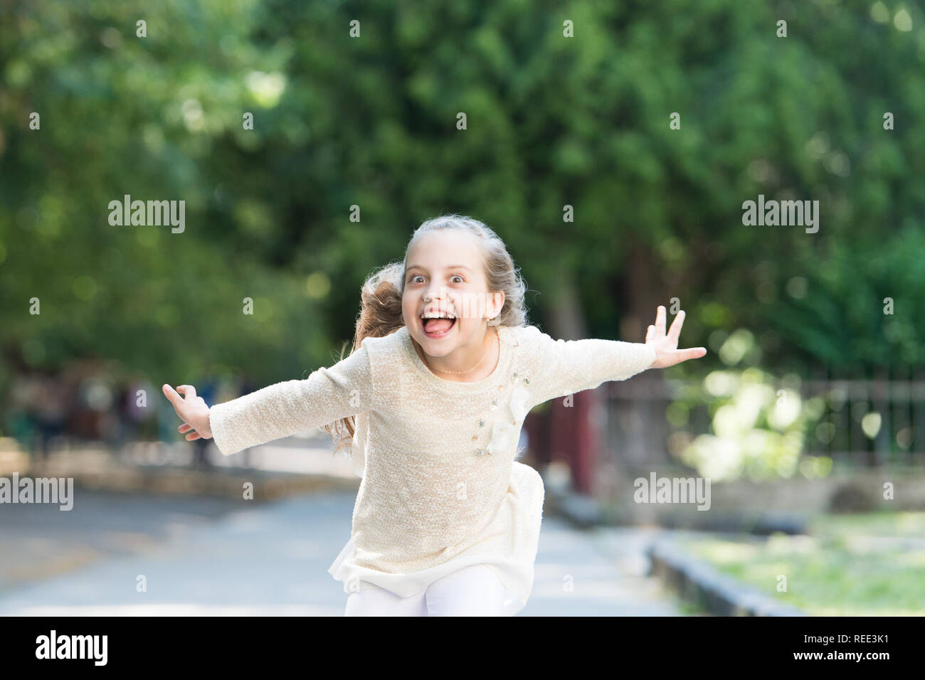 Girl on happy smiling face, nature on background. Child happy and ...
