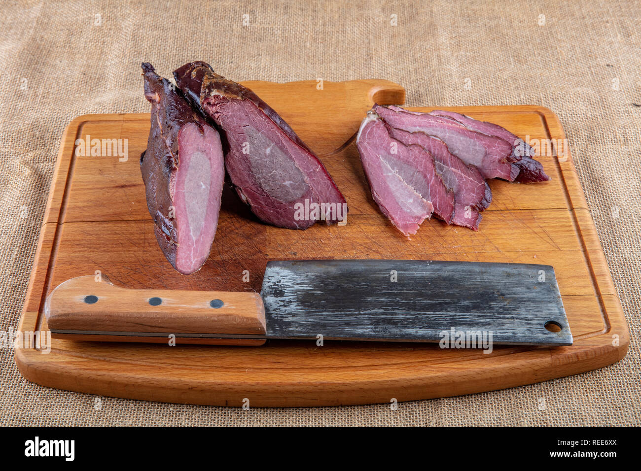 Smoked meats (Dried meat ) on wooden background Stock Photo - Alamy