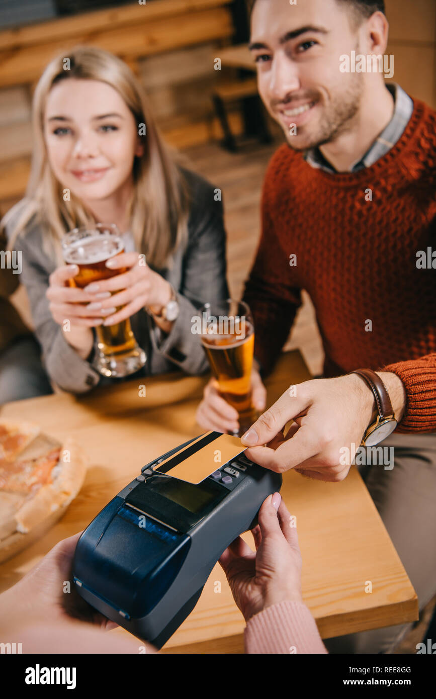 Man paying for drinks credit card pub hi-res stock photography and ...
