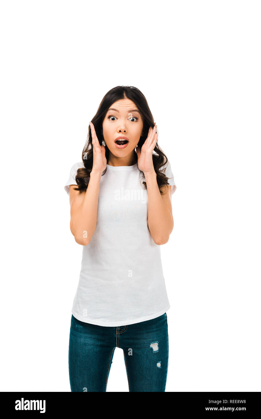 scared young woman with open mouth looking at camera isolated on white ...