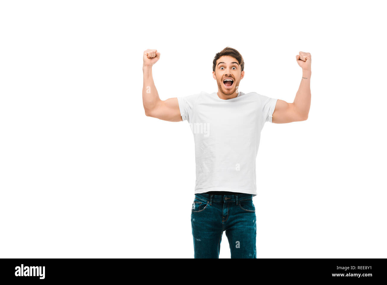 excited young man showing muscles and smiling at camera isolated on ...