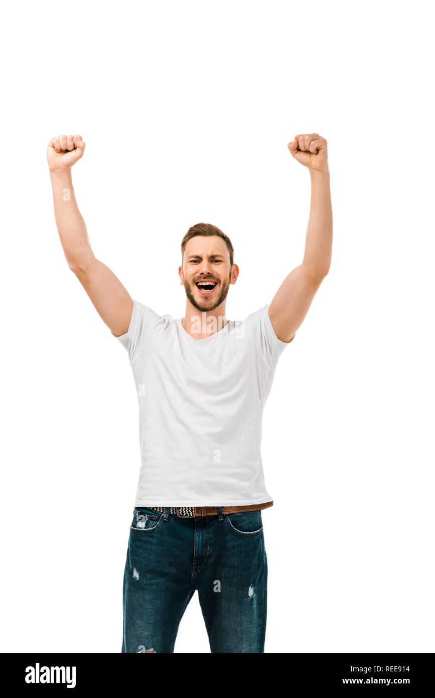 handsome happy man raising hands and shaking fists isolated on white ...
