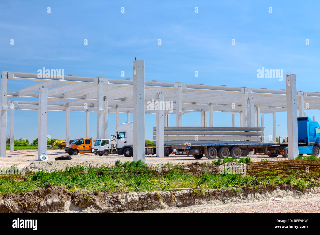 Trucks with trailers are transporting long and heavy concrete beams to ...