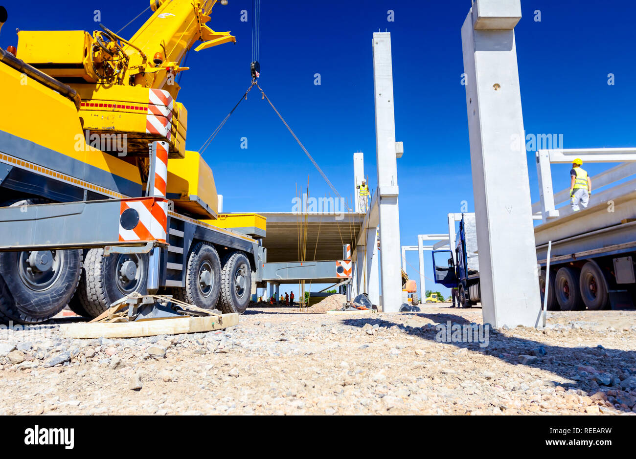 Low angle view on extended side hydraulic outrigger to increase crane ...