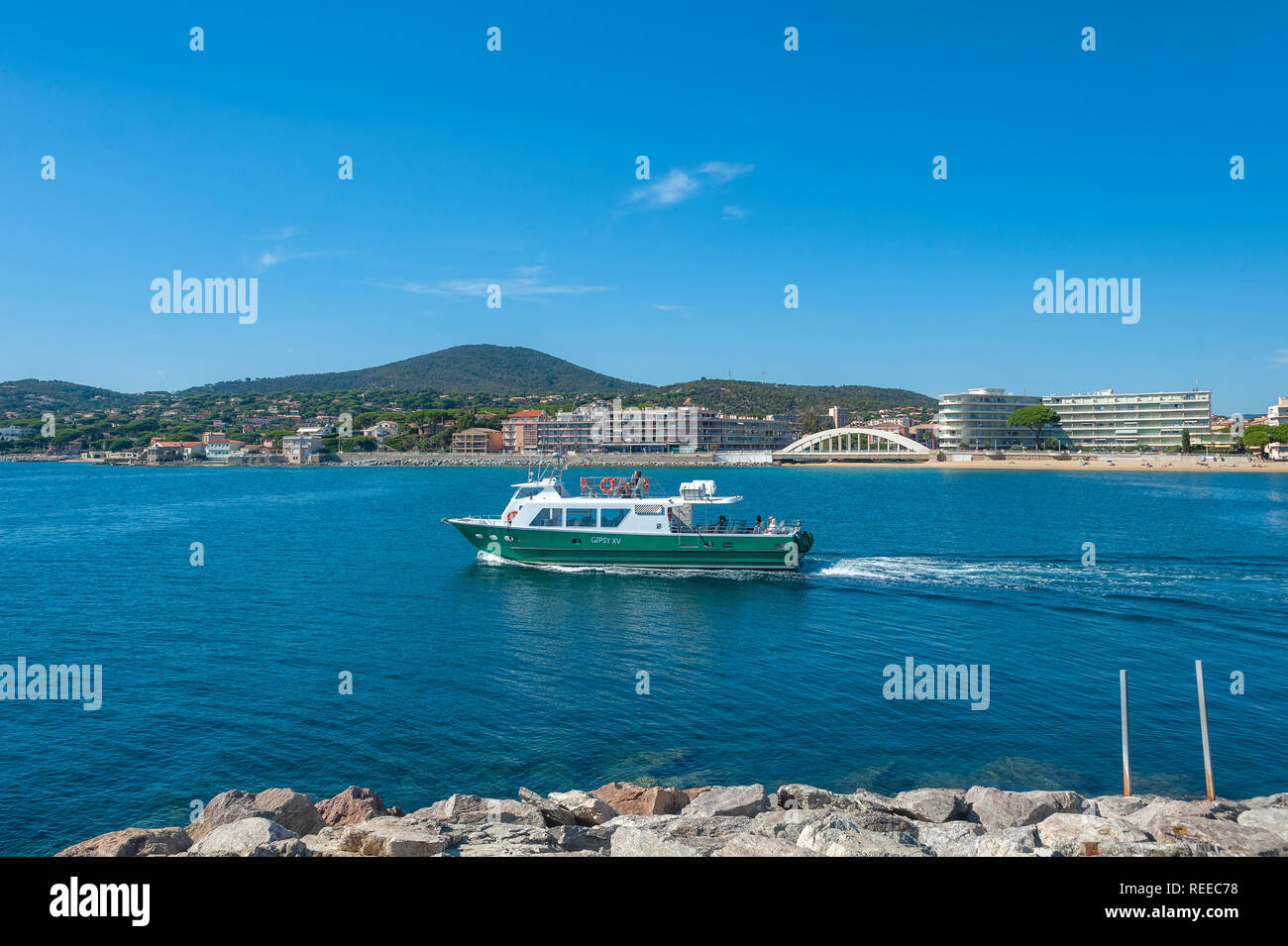 Tourist boat with cityscape, Sainte-Maxime, Var, Provence-Alpes-Cote d ...